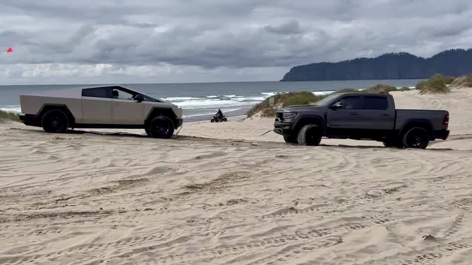 Ram 1500 TRX Rescues A Stuck Tesla Cybertruck From The Sand - 5th Gen Rams
